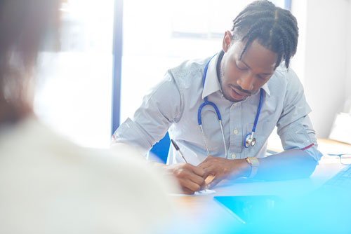 Doctor writing a prescription