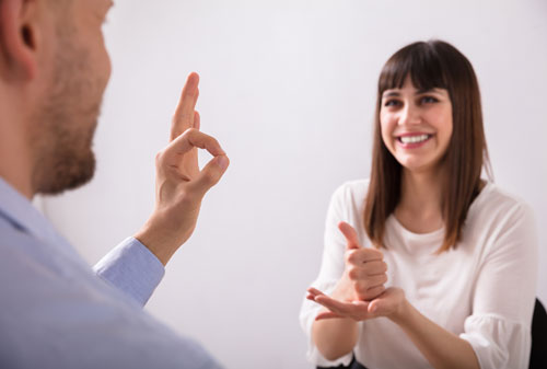 People speaking in sign language